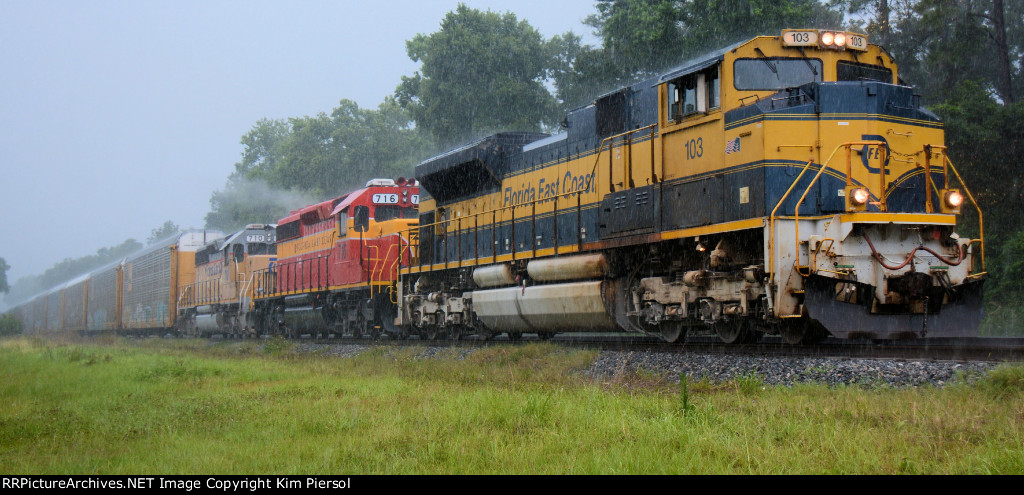 FEC 103 716 (Heritage) 710 on Train 101 in Driving Rainstorm